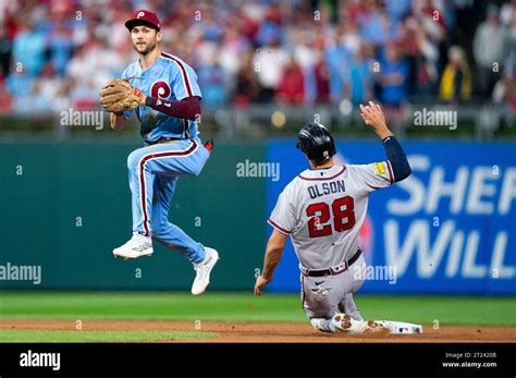 Philadelphia Phillies Shortstop Trea Turner Left Turns The Double Play As Atlanta Braves Matt