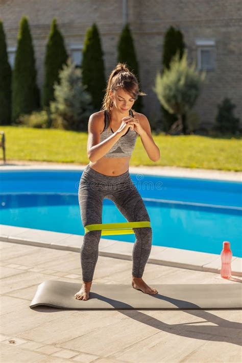 Woman Doing Squats While Training Outdoors Stock Image Image Of