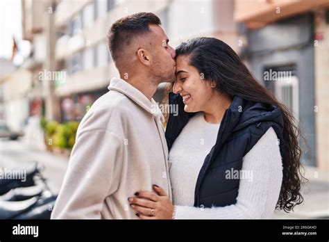 Man And Woman Couple Hugging Each Other And Kissing At Street Stock
