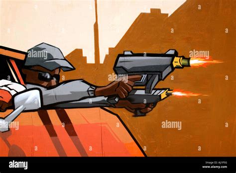 Graffiti Of A Man Firing Two Guns From A Car Stock Photo Alamy