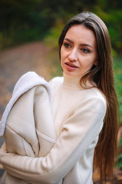 Premium Photo A Woman With Long Hair Wearing A White Sweater A Woman