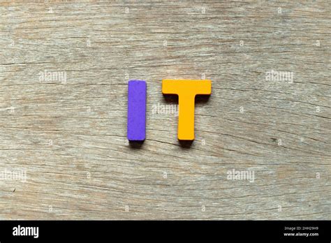 Color Alphabet Letter In Word It Abbreviation Of Information Technology On Wood Background