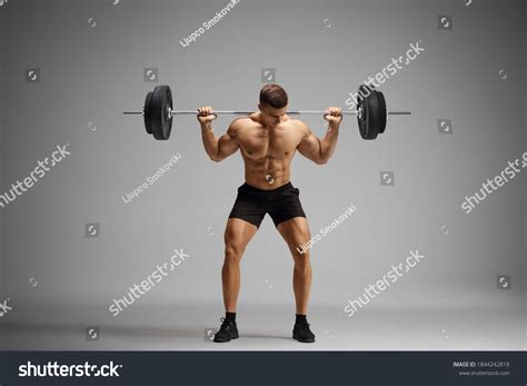 Topless Bodybuilder Lifting Weights On Gray Stock Photo Edit Now