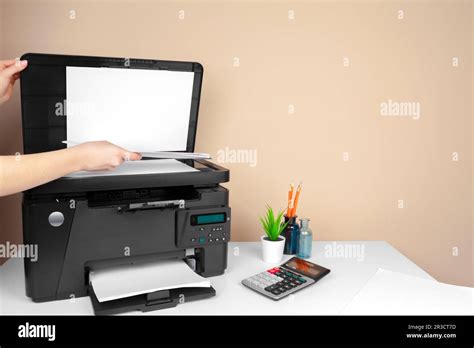 Woman Using The Printer To Scanning And Printing Document Stock Photo Alamy