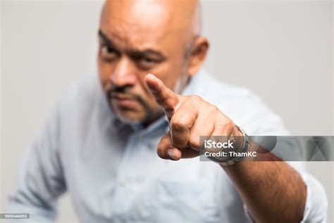 Focus On Finger Of Angry Man With Aggressive Facial Expression Stock
