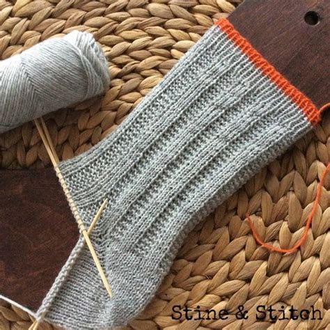 Two Skeins Of Yarn Sitting On Top Of A Woven Basket