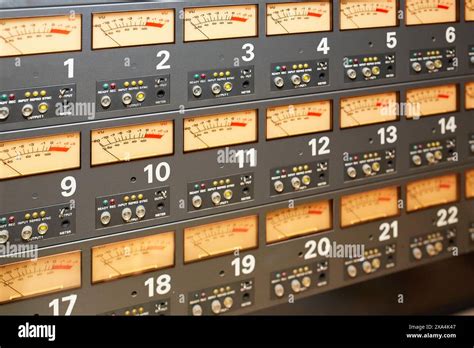 A Close Up Of An Industrial Control Panel With Numbered Gauges Dials