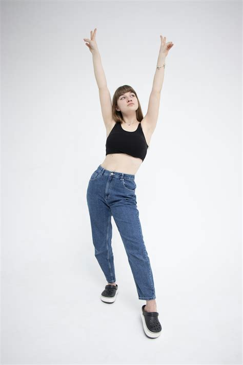 Woman In Black Sports Bra And Blue Denim Jeans Photo Free Denim Image