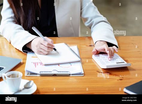 Financial Planning Marketing And Accounting Asian Woman Economist Using Calculator To