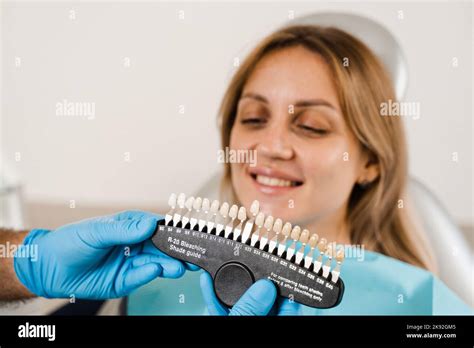 Teeth Color Shades Guide With Woman Patient Tooth Whitening Dentist