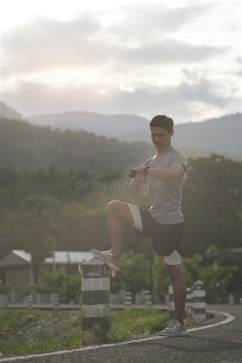 Athletic Man In Sportswear Resting And Checking Performance Heart Rate Pulse Trace On His