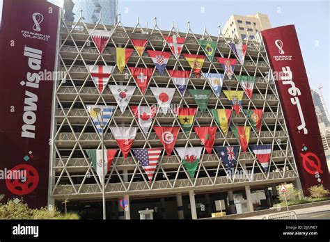 Flags Of All 32 Participating Nations Display On A Building Facade For