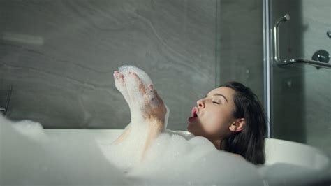 Premium Photo Smiling Girl Blowing Foam In Tub In Bathroom Beautiful