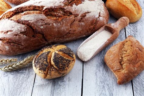 Different Kinds Of Bread And Bread Rolls On White Board Kitchen Stock Photo Image Of Fresh