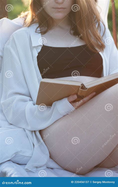 Girl Reading A Book In Bed Among The Fields Stock Image Image Of