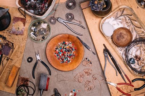 Premium Photo Handmade Copper Wire Working Tools On The Table With