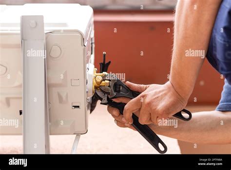 Man Holds Wrench In His Hand Male Technician Using Spanner When