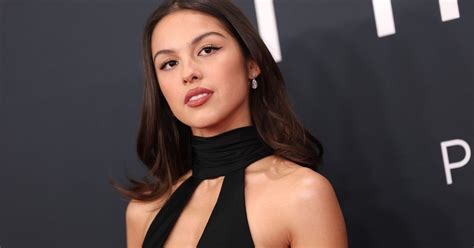 Olivia Rodrigo Brings Bold Glam To Grammys In Risqué Versace Dress