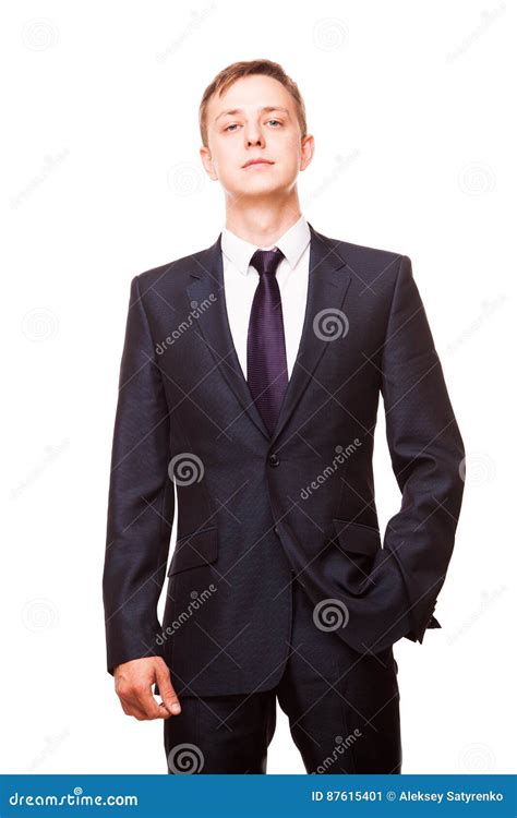 Young Handsome Businessman In Black Suit Is Standing Straight Portrait