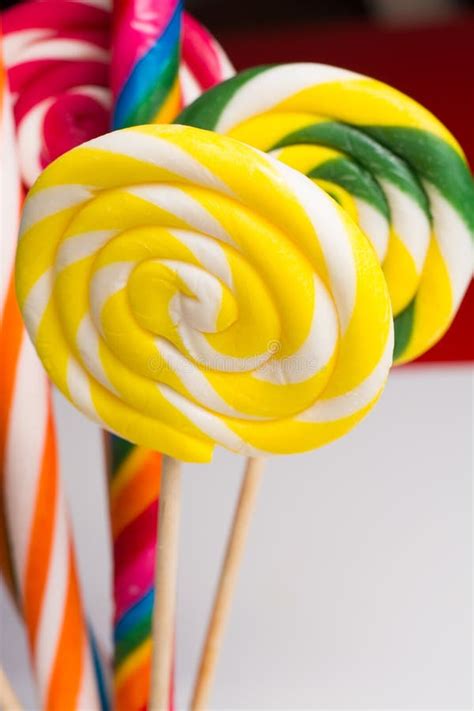 Multicolored Sweet Candy Canes And Twirls On Wooden Sticks Stock Image
