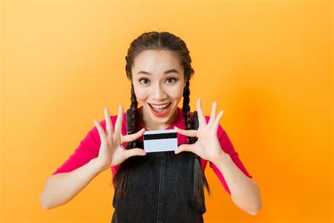 Premium Photo Young Smiling Beautiful Asian Woman Presenting Credit