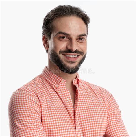 Portrait Of Happy Young Man With Beard Wearing Plaid Shirt And Smiling