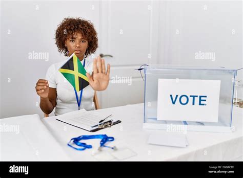 Young African American Woman At Political Campaign Election Holding
