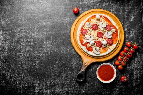 Premium Photo Raw Pizza With Sausages Cheese And Mushrooms