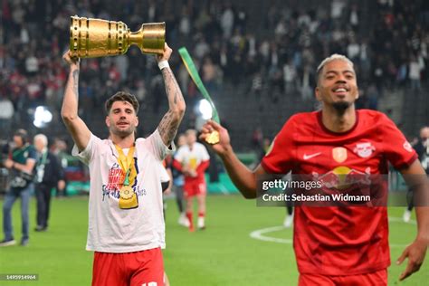 Dominik Szoboszlai Of Rb Leipzig Lifts The Dfb Cup Trophy After The