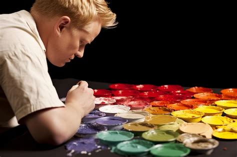 Premium Photo Man Blending Colors For His Painting