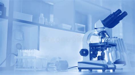 Microscope And Test Tubes On The Background Of The Laboratory Stock