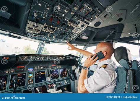 Airline Captain Flipping The Switch On The Overhead Control Panel Stock