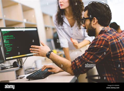 software engineers working on project and programming in company stock