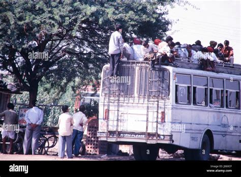 People Sitting On Top Of Bus Bhilwara Rajasthan India Asia Stock