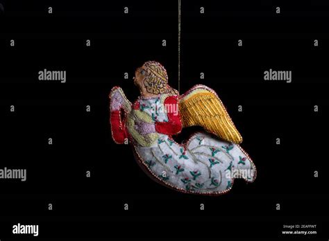 Christmas Decorations On String Angels With Black Background Stock