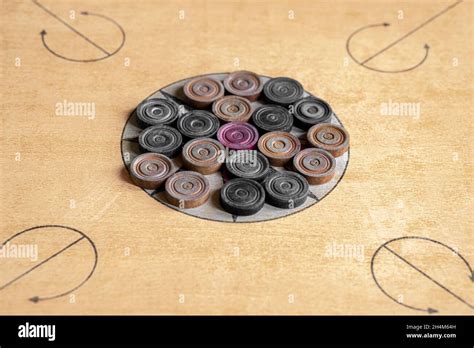Beautiful Image Of The Carrom Board Game Coins Arranged In The Center