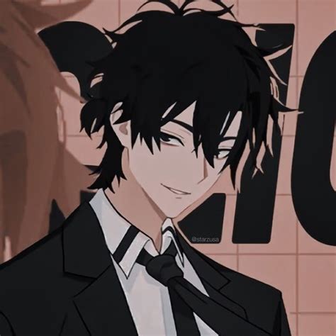 A Man In A Suit And Tie Standing Next To A Wall
