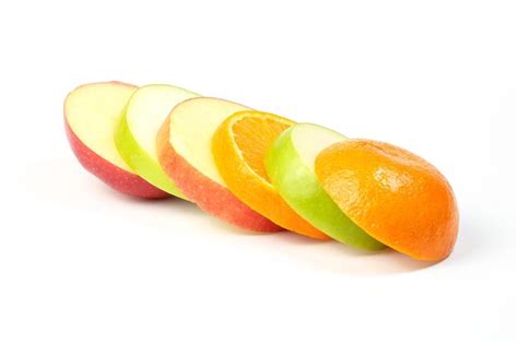 Premium Photo Close Up Of Orange Fruit Against White Background