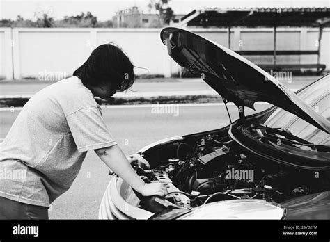 Asian Woman 40s Alone Driver Checking A Car Engine For Fix And Repair Problem With Unhappy And