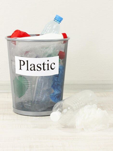 Premium Photo Assorted Trash In Bucket On Room Background