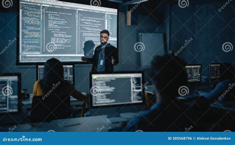 Teacher Giving Computer Science Lecture To Diverse Multiethnic Group Of Female And Male Students