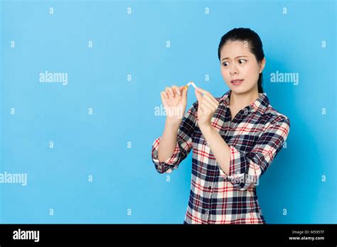 Angry Young Woman Bending Cigarette Showing Quit Smoking Concept