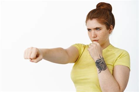 Free Photo Portrait Of Serious Redhead Fitness Girl Stretch Out