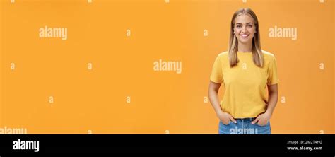 Cute Chubby Female With Tanned Skin And Fair Hair Posing Optimistic And