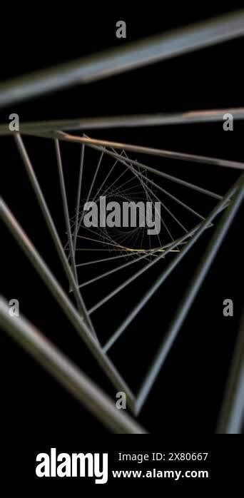 Vertical Video Slowly Moving Through A Shiny Metallic Triangular Shaped Spiral Tunnel