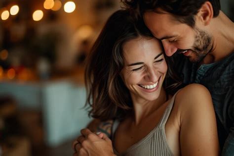 Premium Photo Smiling Couple Dancing And Hugging In Living Room