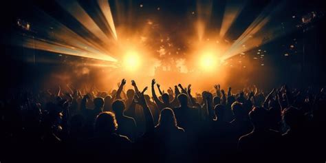 Premium Ai Image Cheering Crowd And Stage Lights Audience At Outdoor