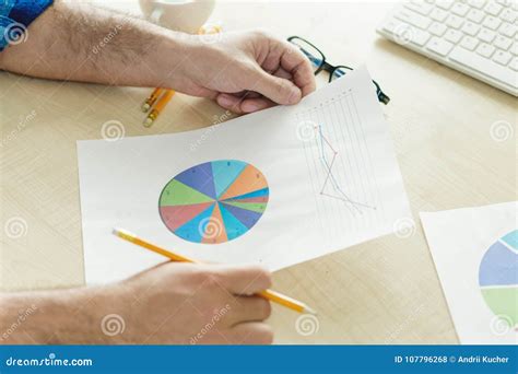 Man Analyzes The Data And Graphs Business Analysis Strategy Co Stock