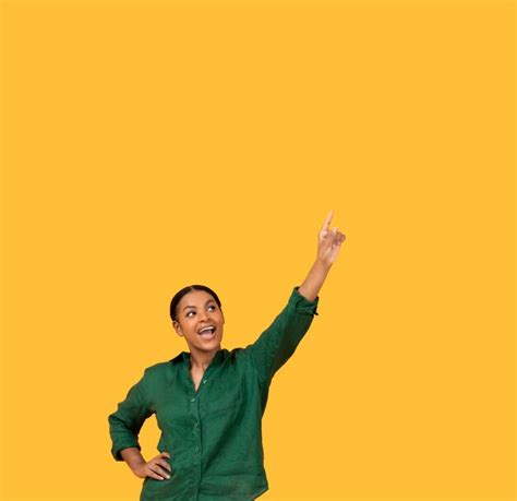 Premium Photo Excited Black Woman Pointing Up Showing Copy Space