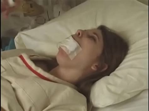 Pretty Brunette In Straitjacket Taped Mouth F Tied To Bed Hospital
